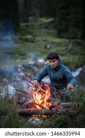 Young Man Making Fire While Camping Stock Photo 1466335994 | Shutterstock