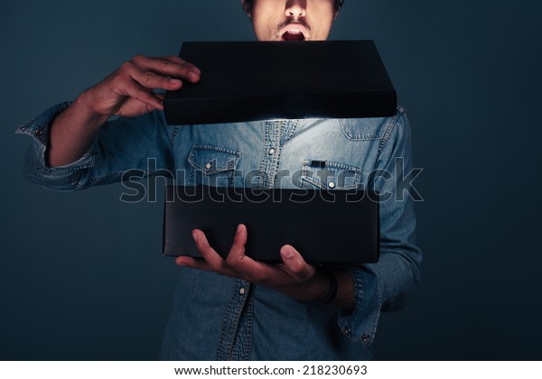 Young Man Opening Box Something Exciting Stock Photo 218230693 ...