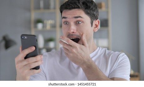 Young Man Shock While Using Smartphone Stock Photo 1451455721 ...