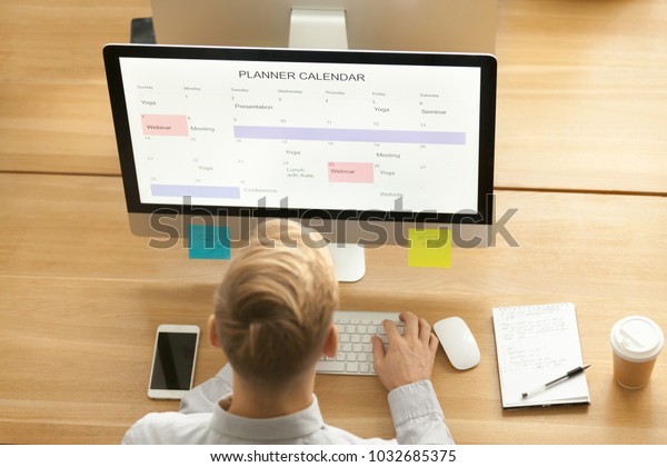 Young Man Using Planner Application On Stock Photo 1032685375 ...