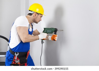 Side View Handsome Man Using Drill Stock Photo (Edit Now) 1013182735