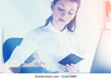 Young Manager Taking Notes Holding Her Stock Photo 516675889 | Shutterstock