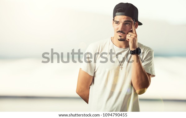 Young Rapper Man Thinking Looking Confused Stock Photo 1094790455 ...
