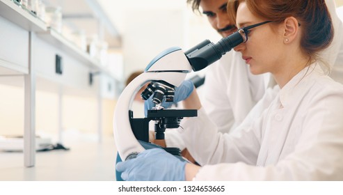 Young Scientist Looking Through Microscope Laboratory Stock Photo 1324653665 | Shutterstock