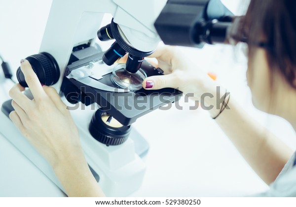 Young Scientist Looking Through Microscope Laboratory Stock Photo ...