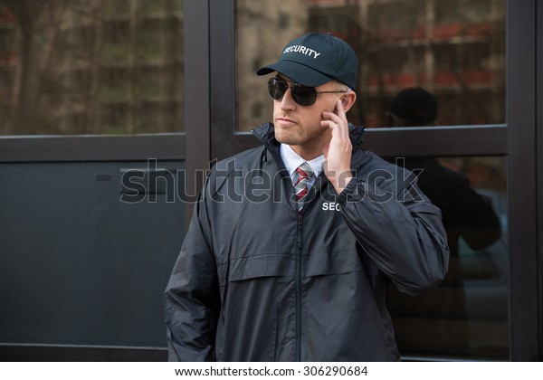 Young Security Guard Standing Front Glass Stock Photo 306290684 ...