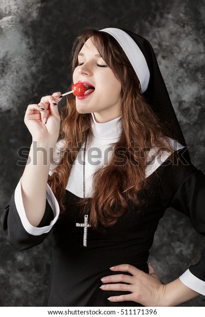 Photo De Stock Young Sexy Nun Stockings Licking Red 511171396