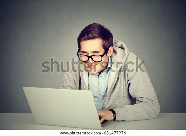 Young Sly Devious Man Using Laptop Stock Photo 631477976 | Shutterstock