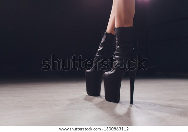 young striptease dancer moving in high heels shoes on stage in strip ...