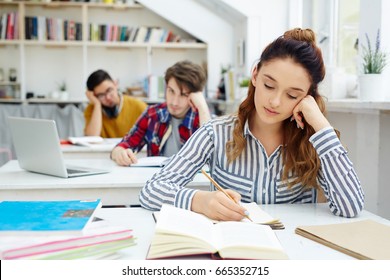 Happy Student Taking Notes While Studying Stock Photo (Edit Now) 1860471403