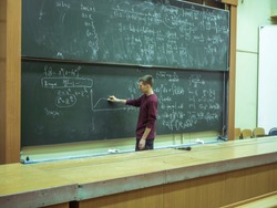 Beautiful student doing homework featuring blackboard, school, and ...