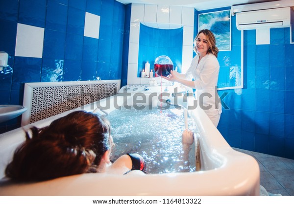 Young Woman During Hydromassage In Beauty Salon Concept Of Body Care