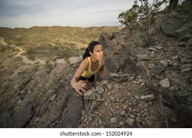 Young Woman Peaking Over Some Boulders Stock Photo 152024924 | Shutterstock