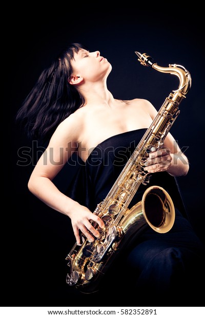 Young Woman Playing Sax Stock Photo (Edit Now) 582352891 Young Woman Playing Sax Stock Photo (Edit Now) 582352891