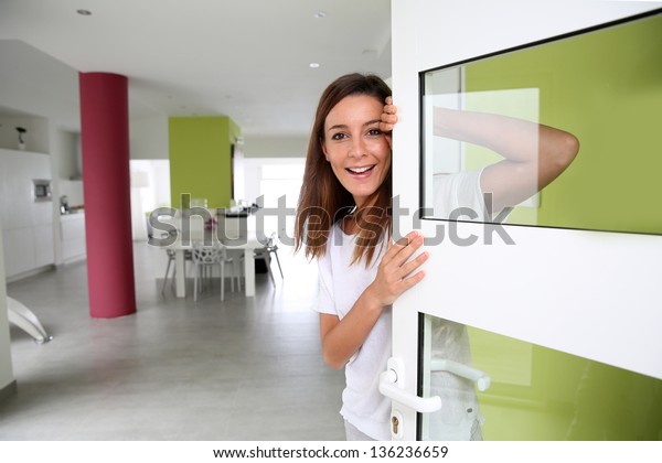 Young Woman Welcoming People Entrance Door Stock Photo (Edit Now) 136236659 Young Woman Welcoming People Entrance Door Stock Photo (Edit Now) 136236659