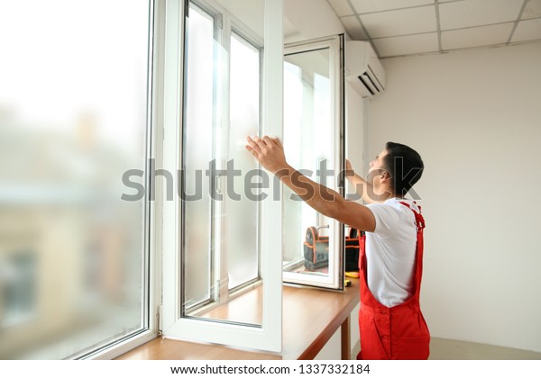 Young Worker Checking Window After Repair Stock Photo (Edit Now) 1337332184