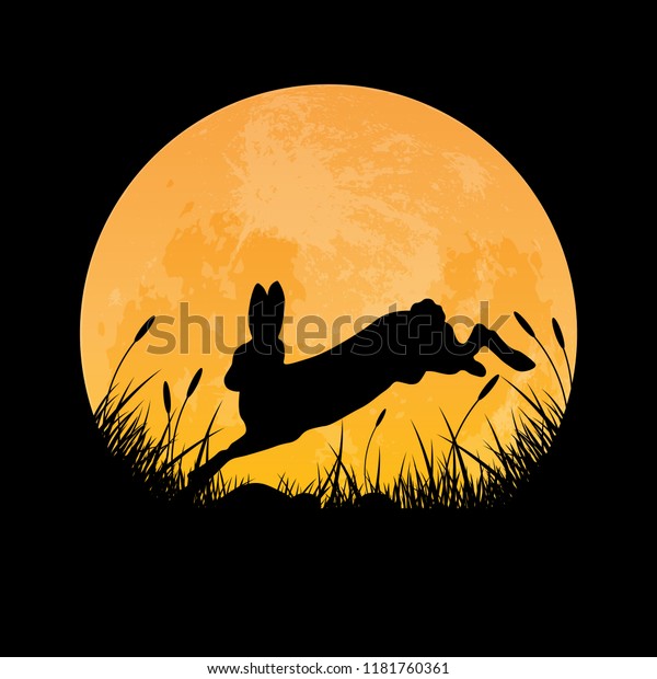 Silhouette of rabbit jumping over grass field with full moon background ...
