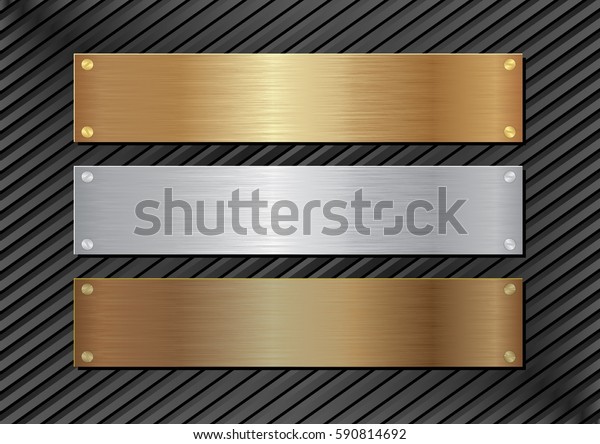 three metal plaques on black background