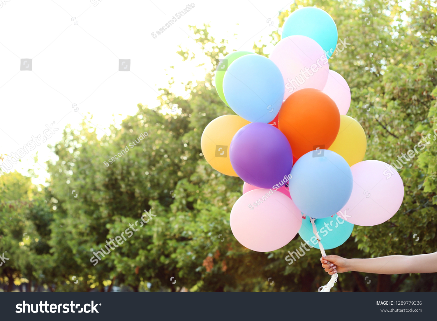 Hand Holding Colored Balloons Park Stock Photo 1289779336 | Shutterstock Hand Holding Colored Balloons Park Stock Photo 1289779336 | Shutterstock