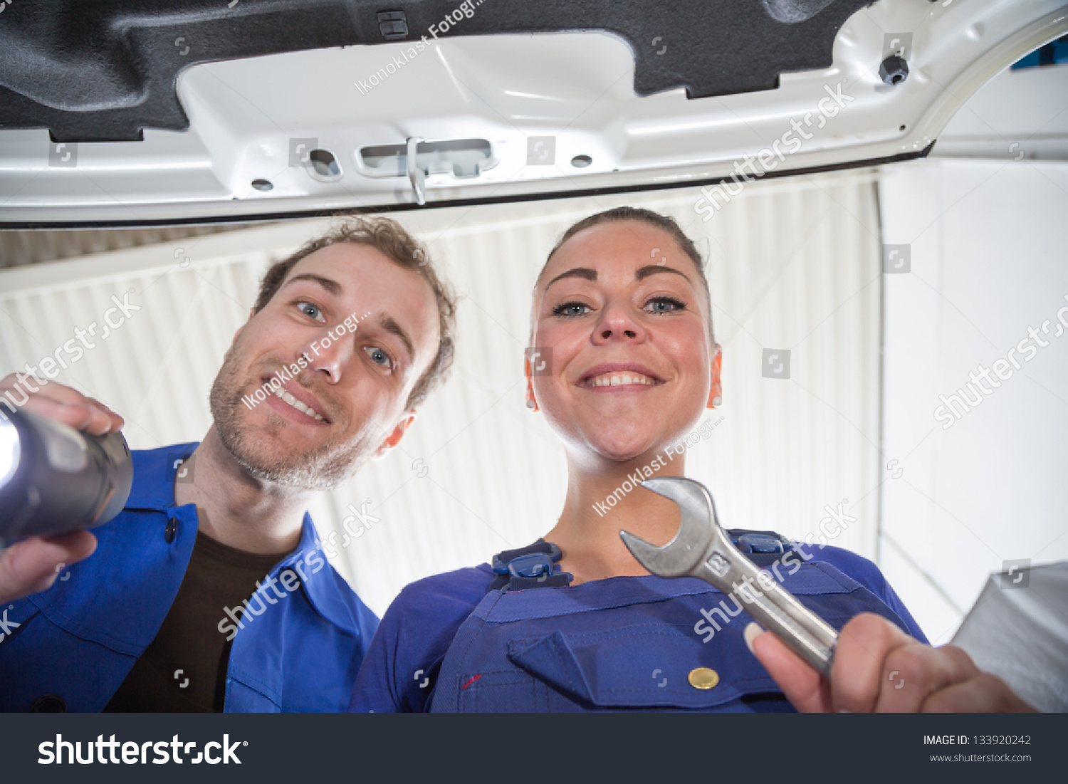 Two Mechanics Taking Look Under Hood Stock Photo 133920242 | Shutterstock Two Mechanics Taking Look Under Hood Stock Photo 133920242 | Shutterstock