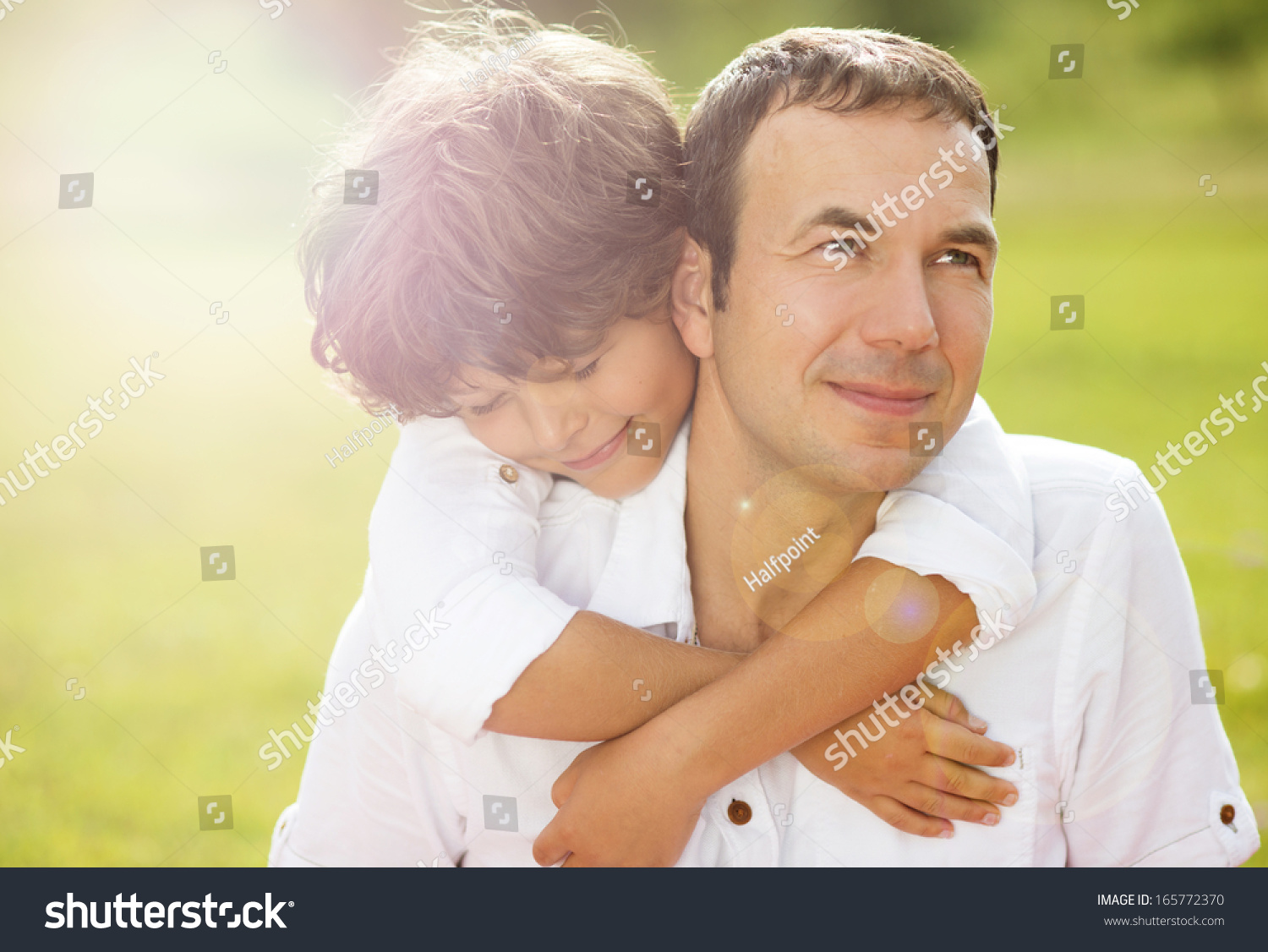 Photo De Stock Father Son Hugging Playing Together Green 165772370