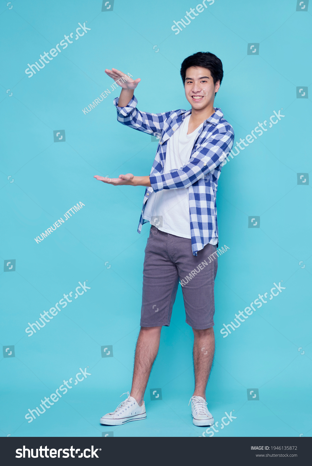 Portrait Handsome Man Presenting On Color Stock Photo 1946135872 ...