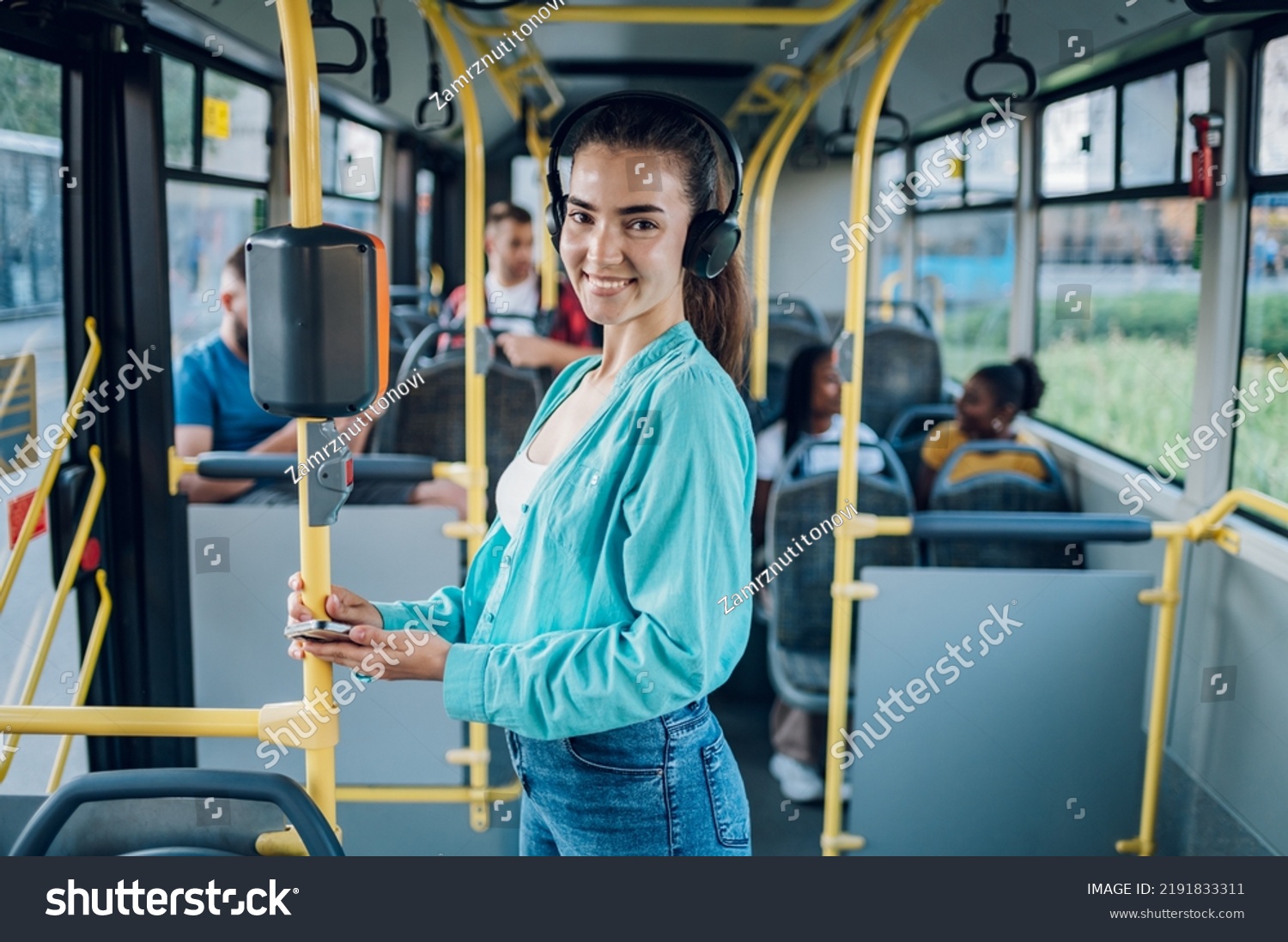 Young Joyful Woman Standing On Bus Stock Photo 2191833311 | Shutterstock Young Joyful Woman Standing On Bus Stock Photo 2191833311 | Shutterstock