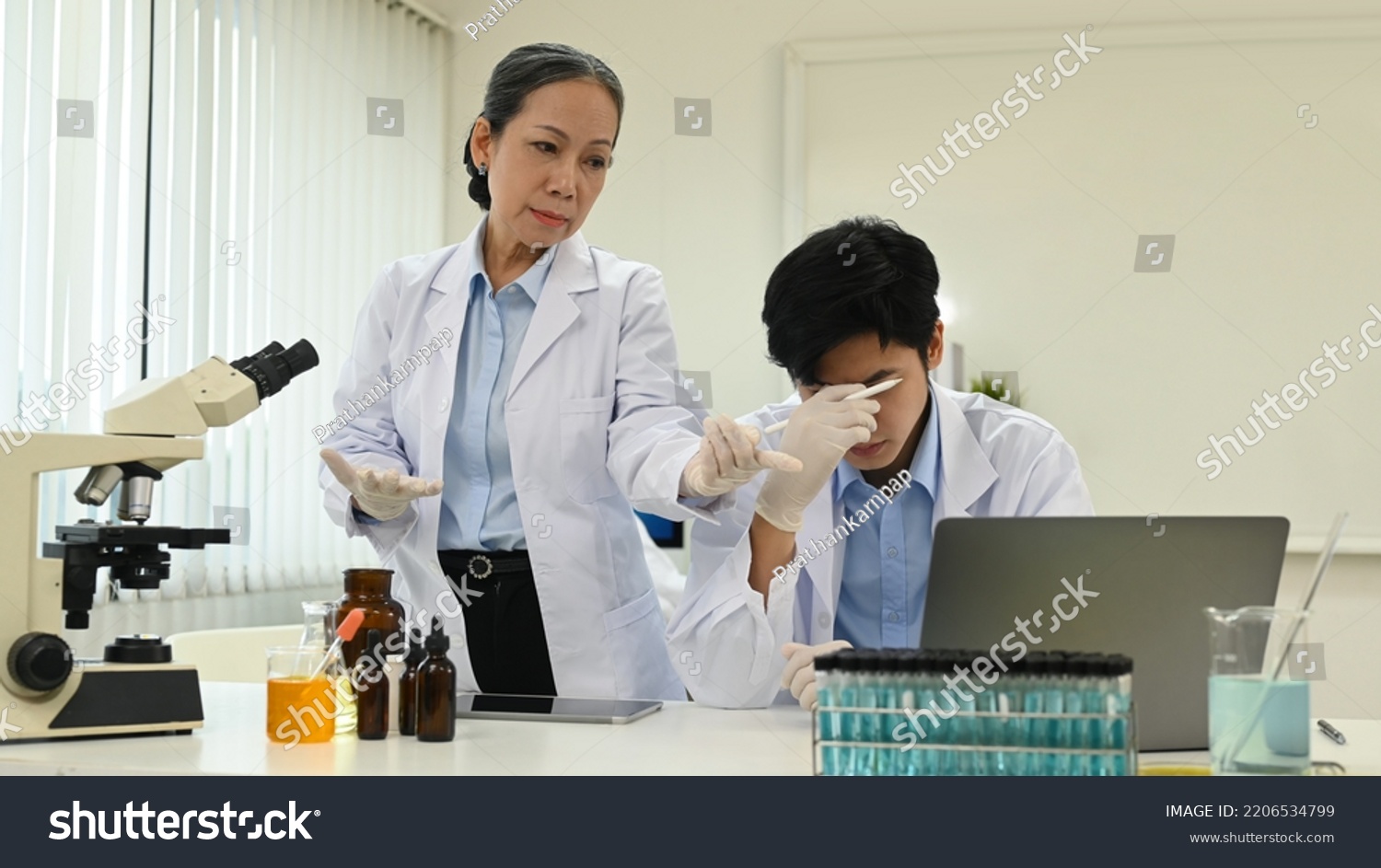 Stressed Asian Male Scientist Feeling Tired Stock Photo 2206534799 ... Stressed Asian Male Scientist Feeling Tired Stock Photo 2206534799 ...