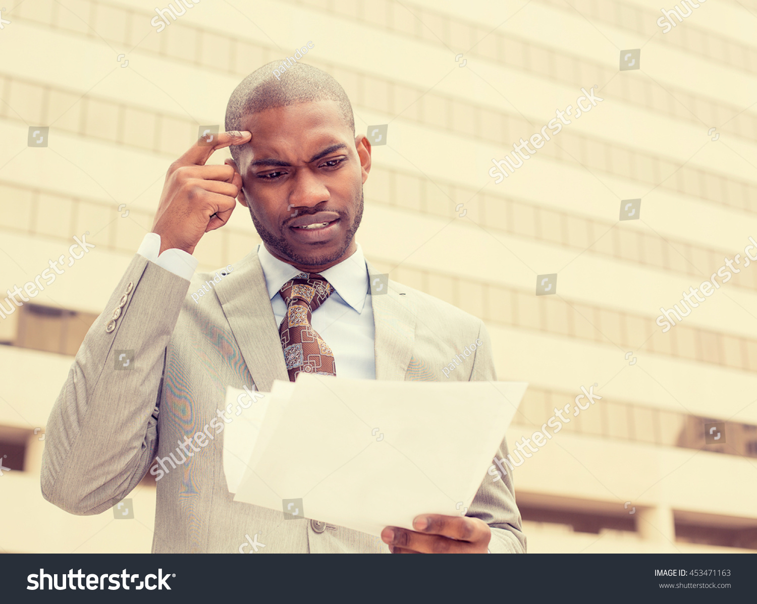 Confused Executive Man Looking Documents Outside Stock Photo 453471163 ... Confused Executive Man Looking Documents Outside Stock Photo 453471163 ...
