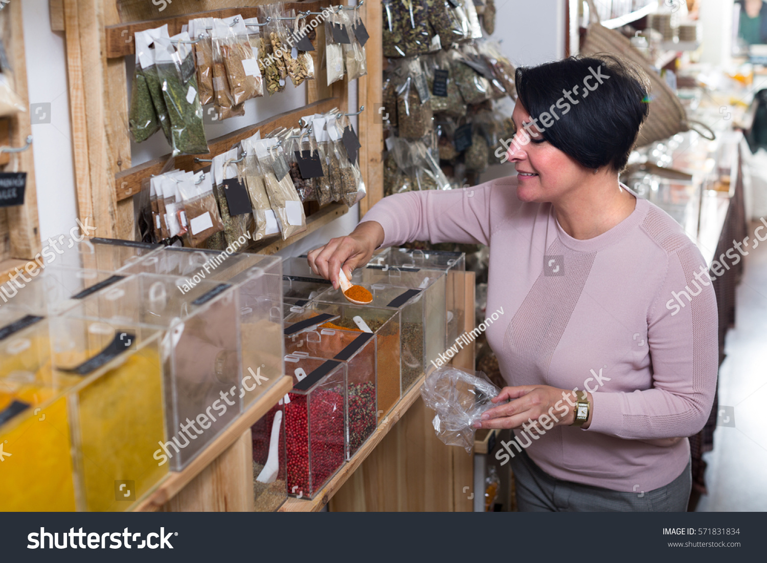 Mature Brunette Woman Choosing Spices Sold Stock Photo 571831834 ... Mature Brunette Woman Choosing Spices Sold Stock Photo 571831834 ...