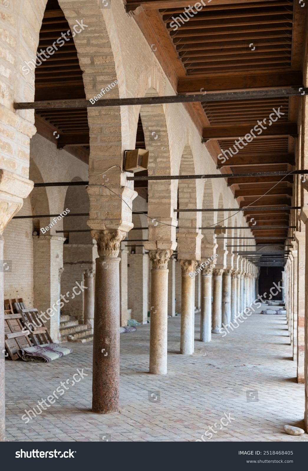 Long narrow passages under arches of temple, - Royalty Free Stock Photo ...