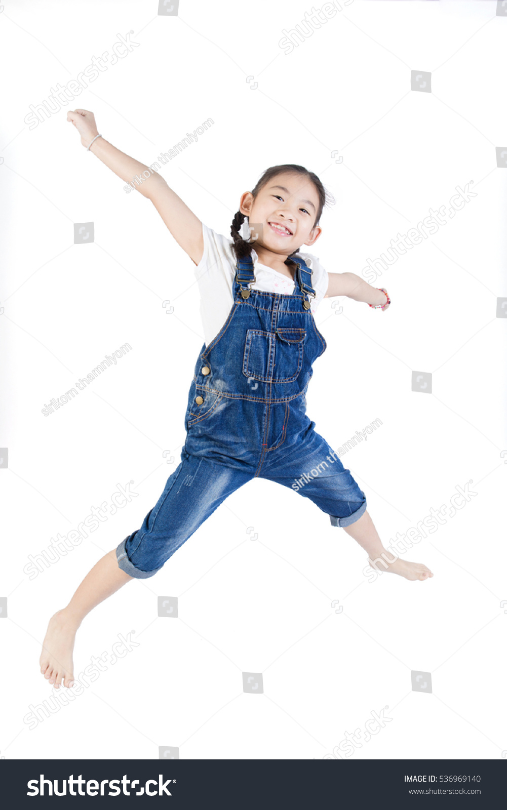 Asian cute child is jumping on white background - Royalty Free Stock ...
