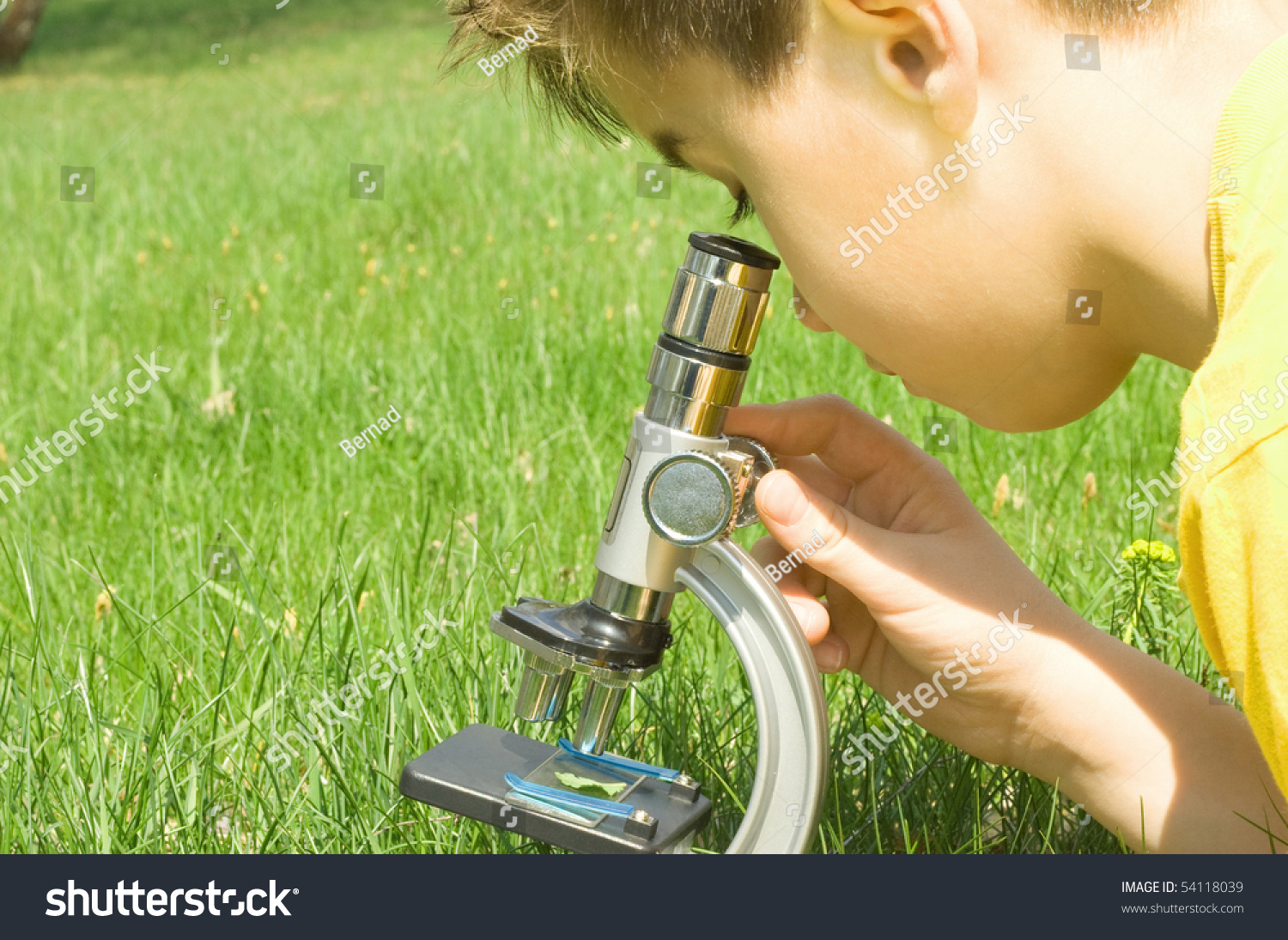 Boy Looking Through Microscope Stock Photo (Edit Now) 54118039