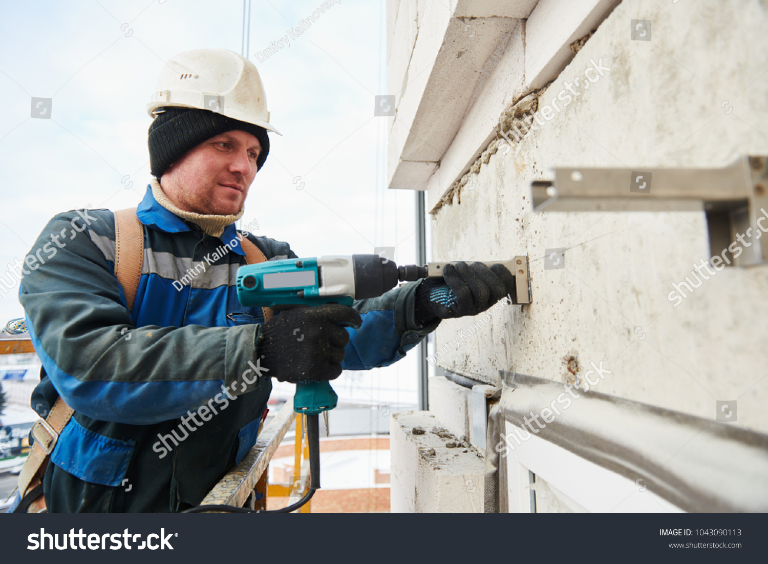 Builder Installing Bracket On Building Facade Stock Photo (Edit Now ...