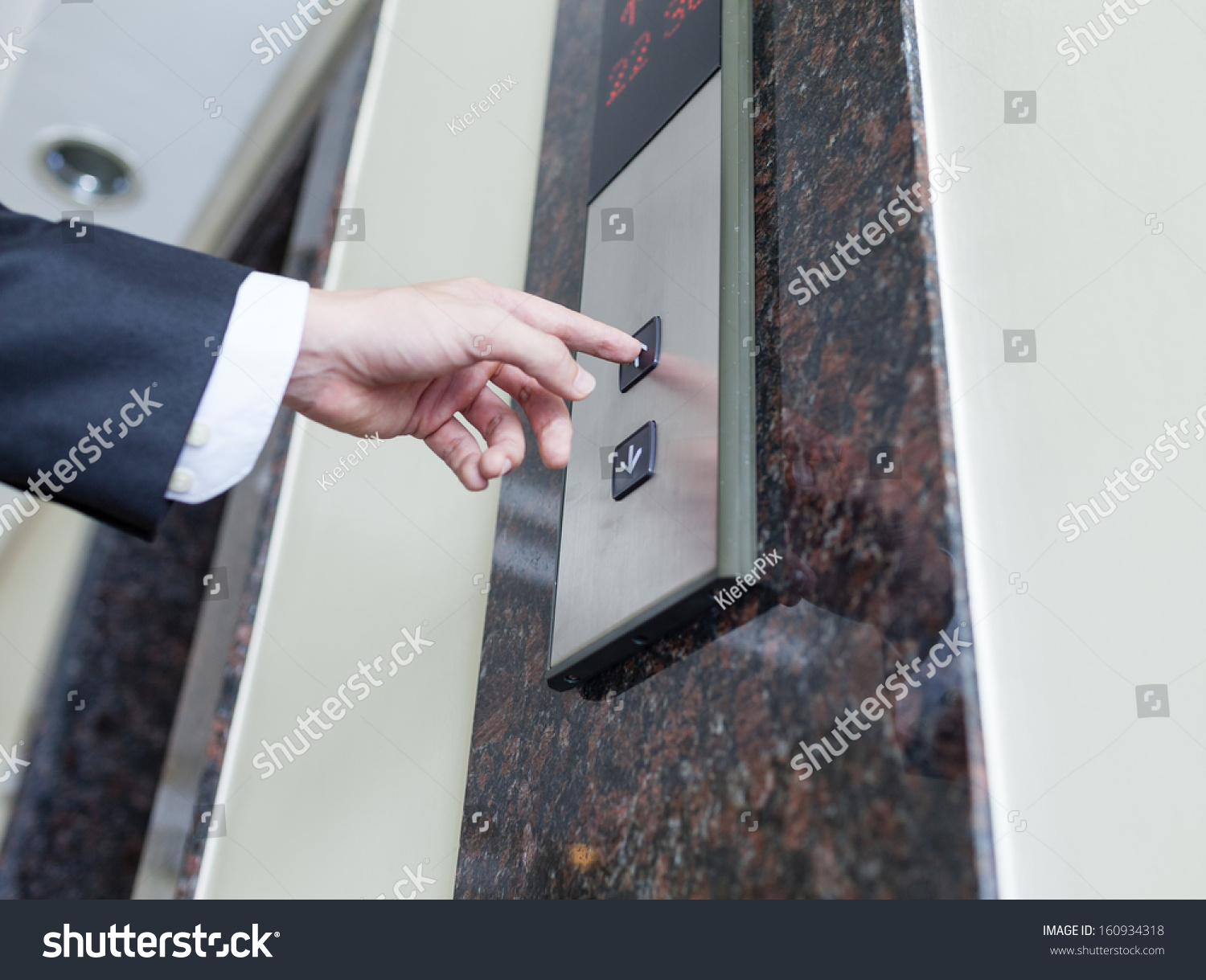 Businessman Pushing Elevator Button Stock Photo (Edit Now) 160934318