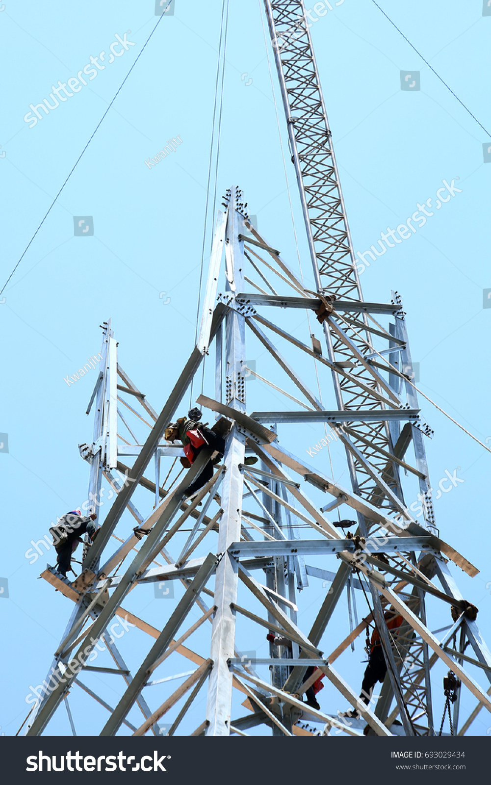 Construction Workers Assembling Power Line Tower Stock Photo 693029434 ...