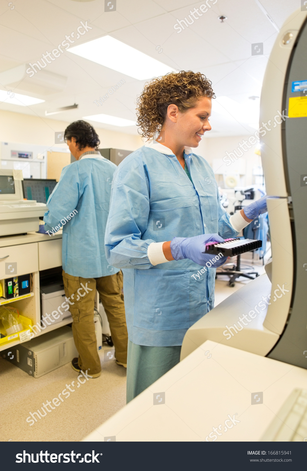 Female Lab Tech Loading Coagulation Machine Stock Photo (Edit Now ...