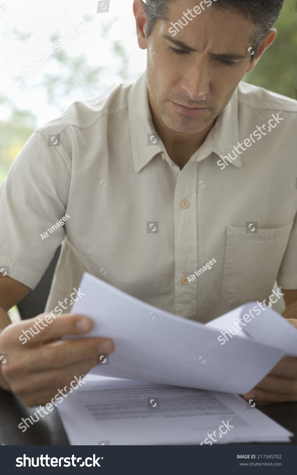 Man Looking Concerned Reading Documents Stock Photo 217345702 ...