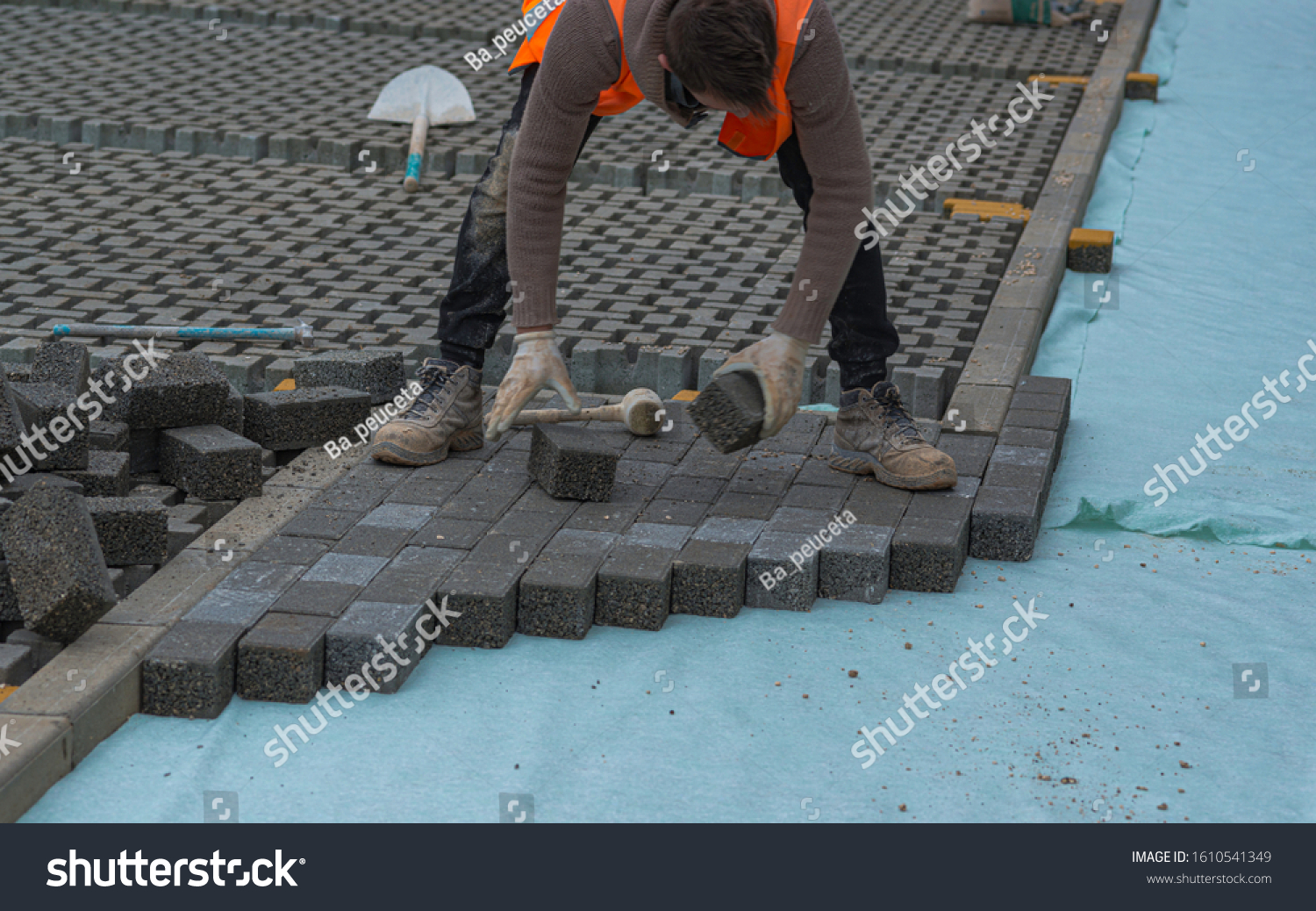 Paving Stone Worker Putting Down Pavers Stock Photo 1610541349 ... Paving Stone Worker Putting Down Pavers Stock Photo 1610541349 ...
