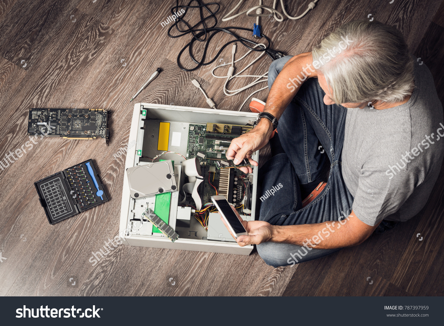 Senior Man Assembling Desktop Computer: foto de stock (editar ahora ...