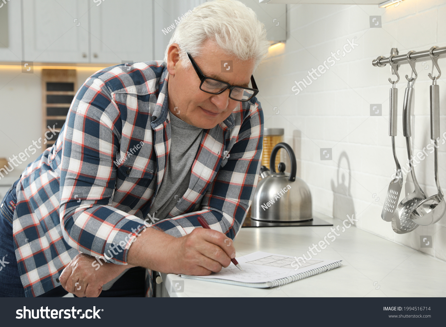 Senior Man Solving Sudoku Puzzle Kitchen Stock Photo 1994516714 ... Senior Man Solving Sudoku Puzzle Kitchen Stock Photo 1994516714 ...
