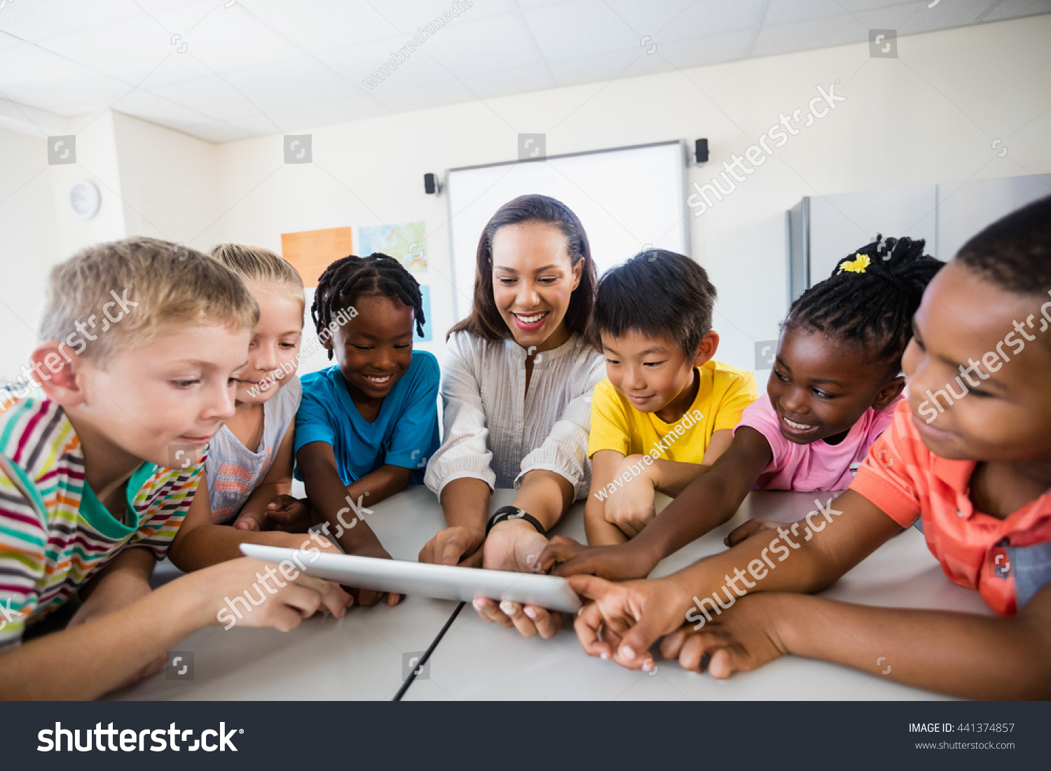 Smiling Class Using Tablet Computer Classroom Stock Photo (Edit Now ...
