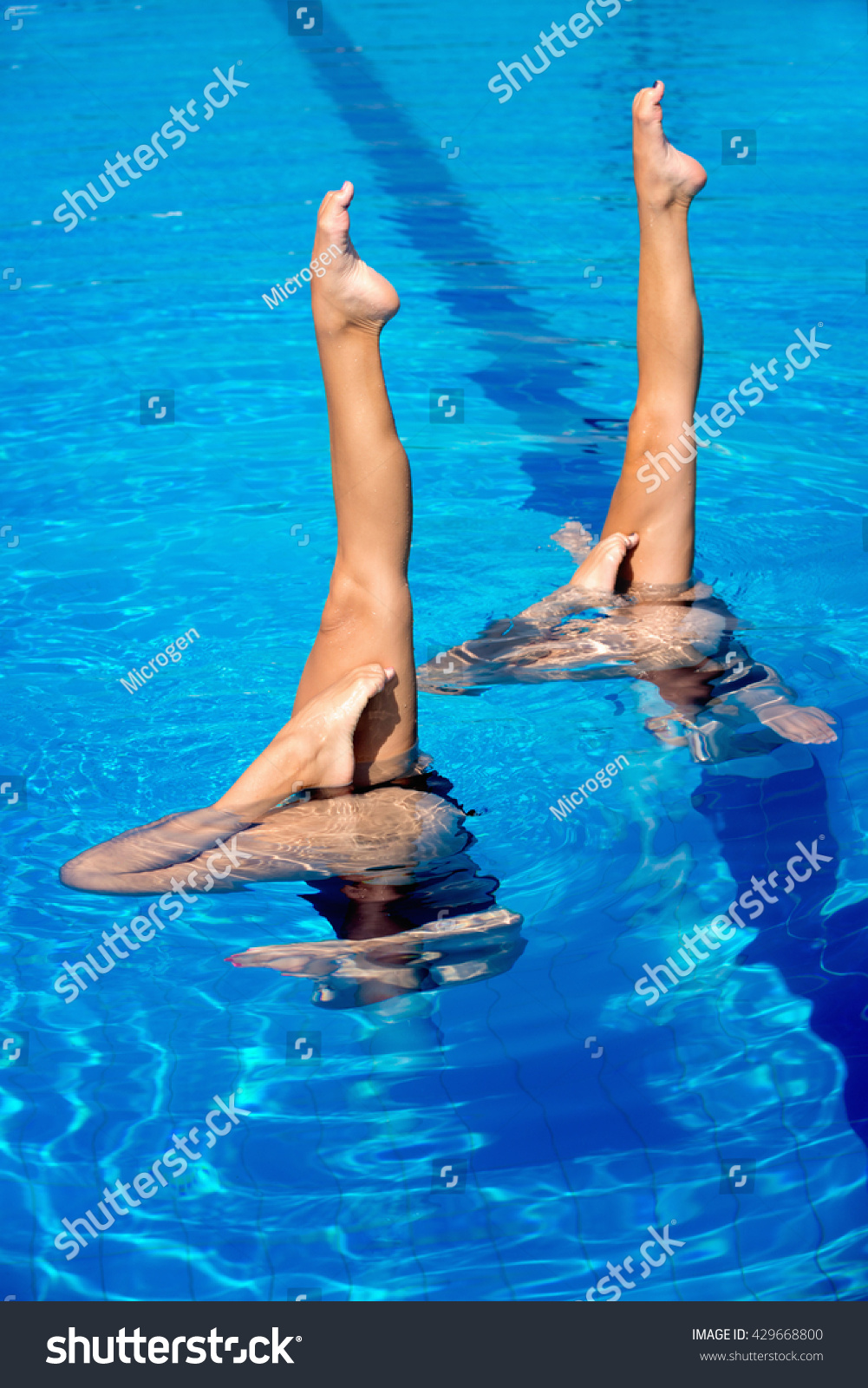Synchronized Swimmers Performance Legs Outside Water Stock Photo ... Synchronized Swimmers Performance Legs Outside Water Stock Photo ...