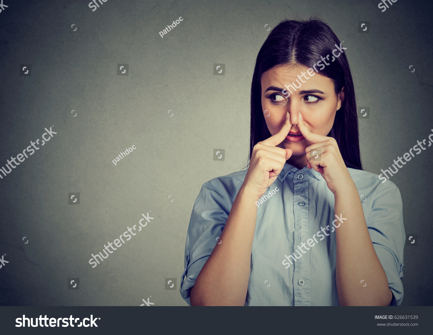 Woman Pinches Nose Fingers Looks Disgust Stock Photo (Edit Now) 626631539 Woman Pinches Nose Fingers Looks Disgust Stock Photo (Edit Now) 626631539