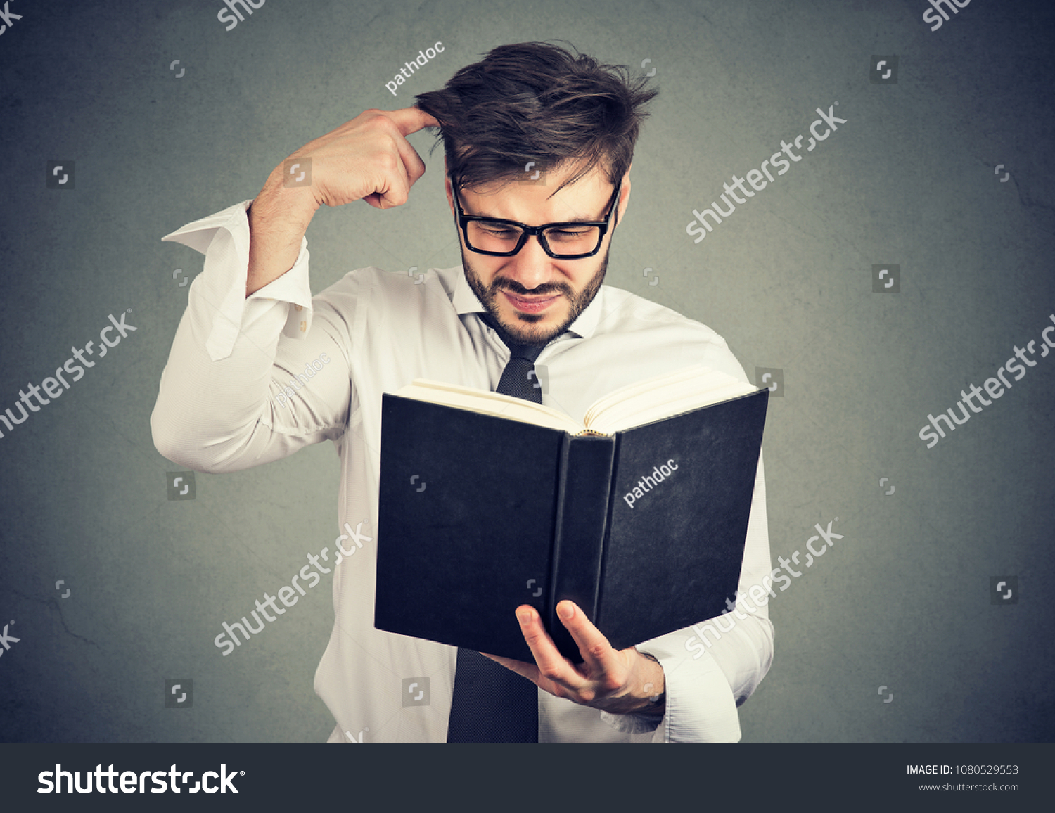 Young Confused Man Scratching Head While: foto stock (editar agora ... Young Confused Man Scratching Head While: foto stock (editar agora ...