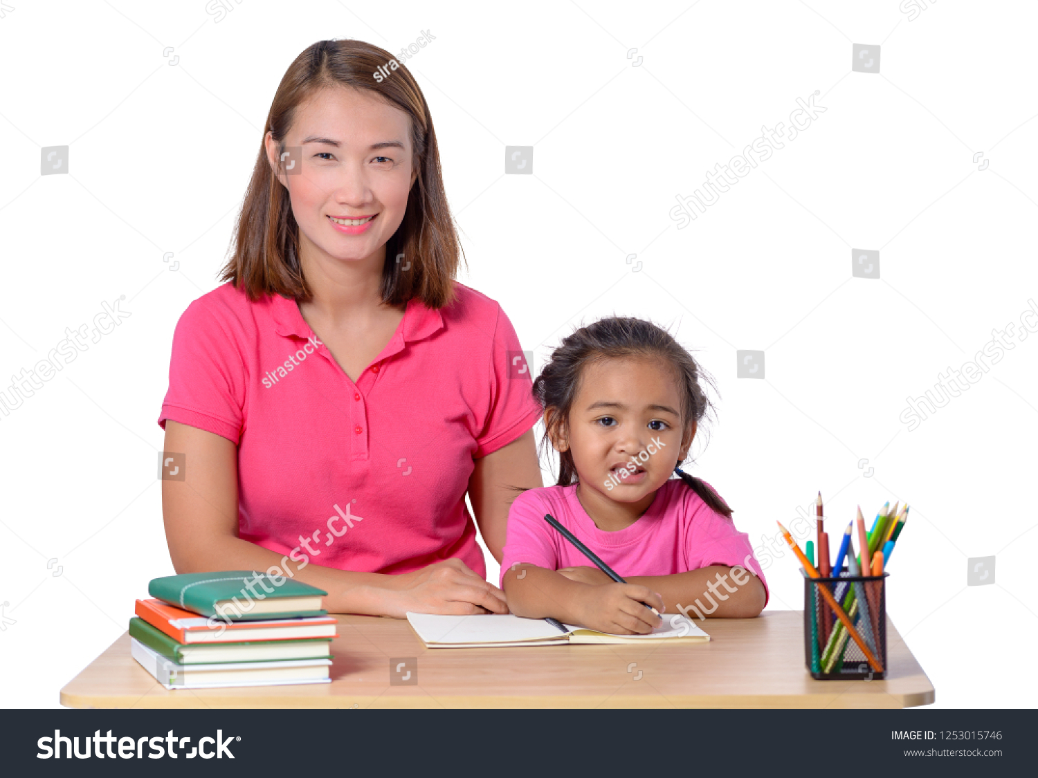 Young Teacher Helping Child Writing Lesson Stock Photo 1253015746 ... Young Teacher Helping Child Writing Lesson Stock Photo 1253015746 ...