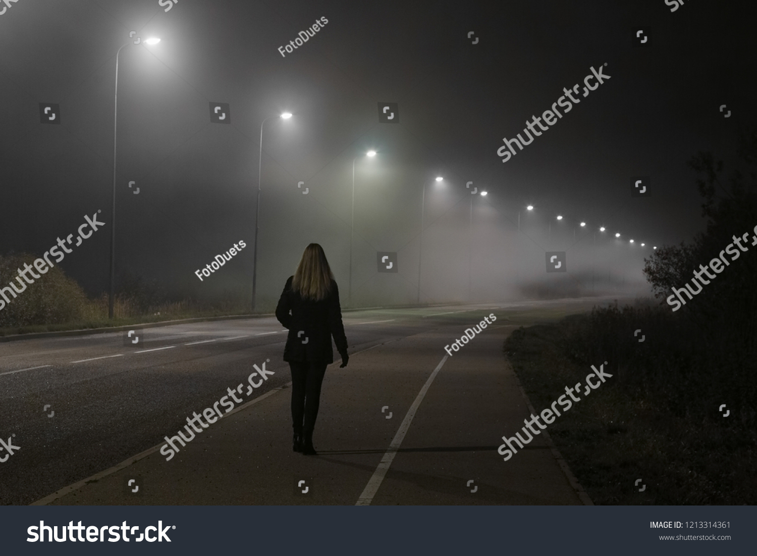 Young Woman Alone Slowly Walking Under Stock Photo 1213314361 ... Young Woman Alone Slowly Walking Under Stock Photo 1213314361 ...