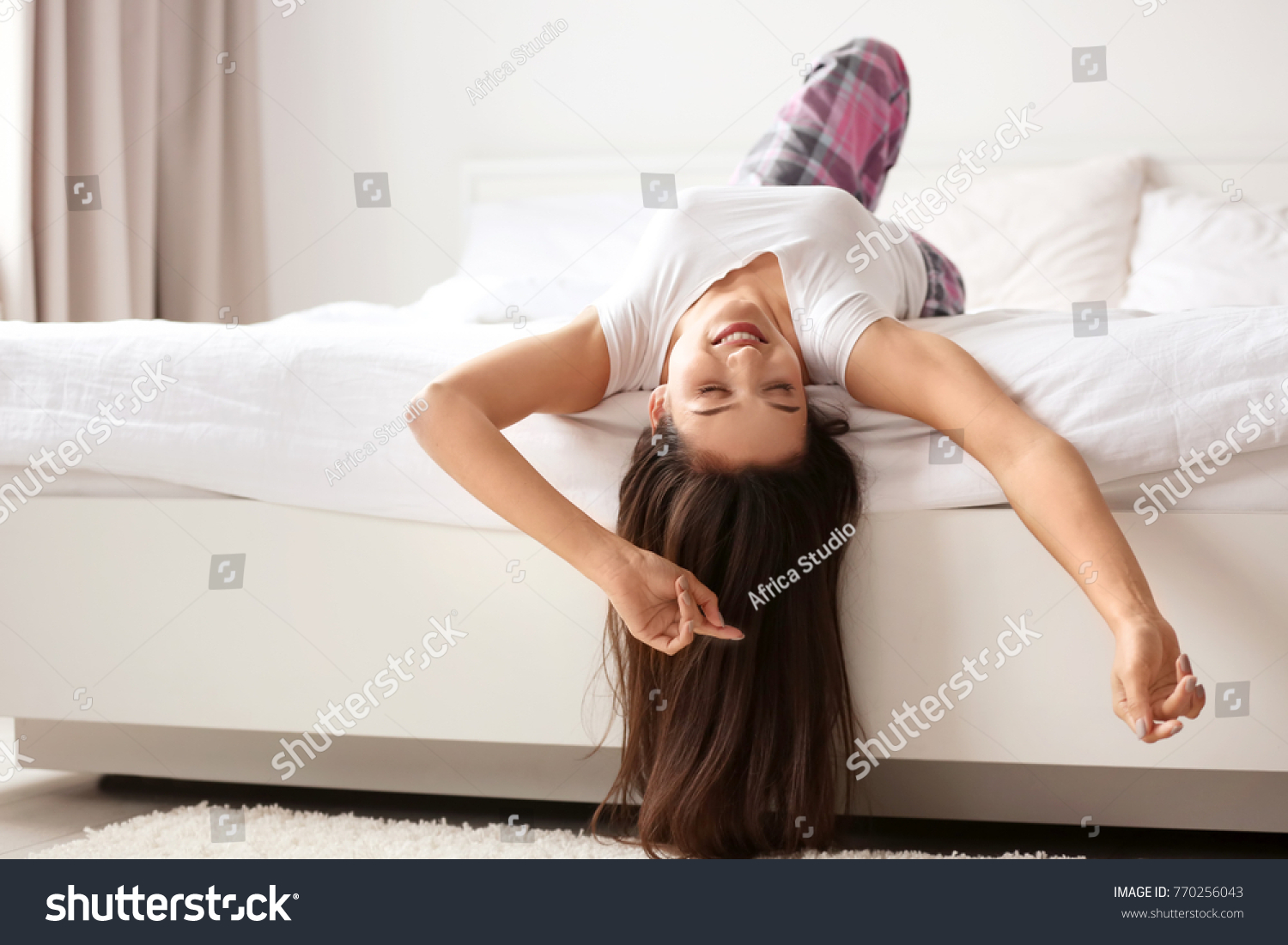 Young Woman Lying Upside Down Bed Stock Photo (Edit Now) 770256043 Young Woman Lying Upside Down Bed Stock Photo (Edit Now) 770256043